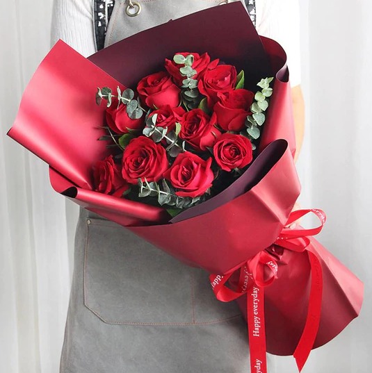 Deep love(11 red roses interleaved with eucal)